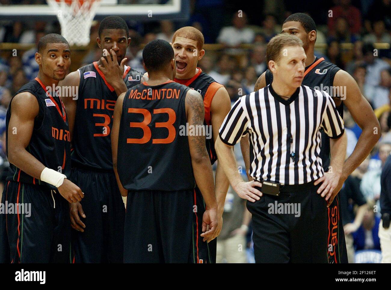 Miami huddles at mid-court as officials decide what to do after a hard ...