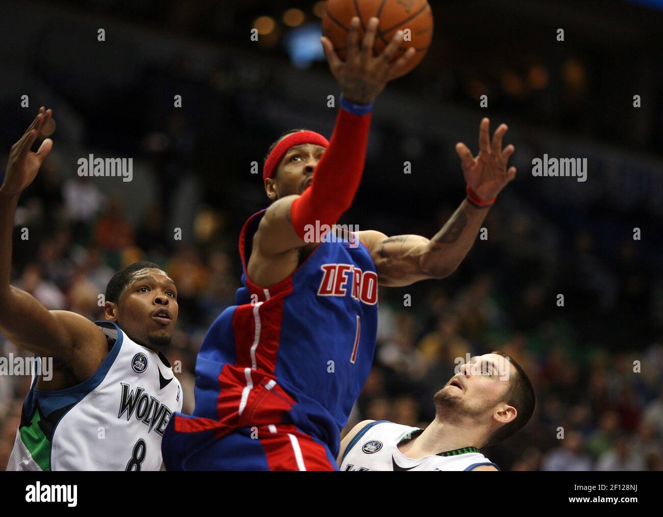 The Detroit Pistons' Allen Iverson (1) spilts the defense of Minnesota ...
