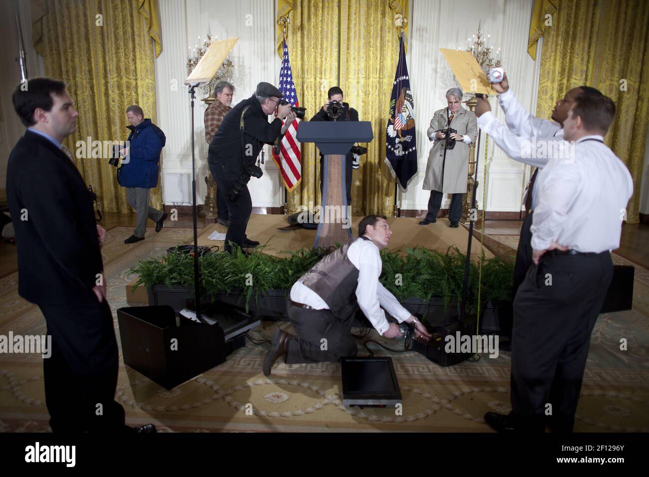 White House staff set tele-prompters in front of the president's podium ...