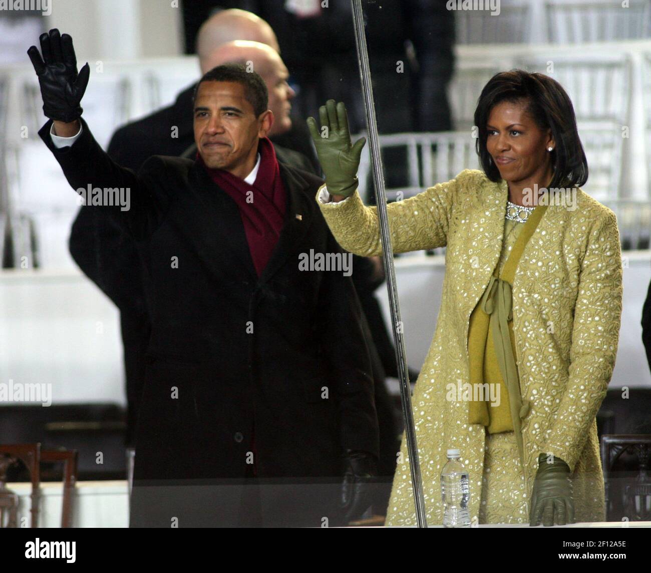 President Barack Obama and First Lady Michelle Obama wave during the ...