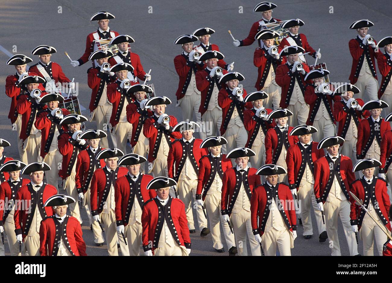 A ilitary band marches dressed in 'Red Coats' as they participate in ...