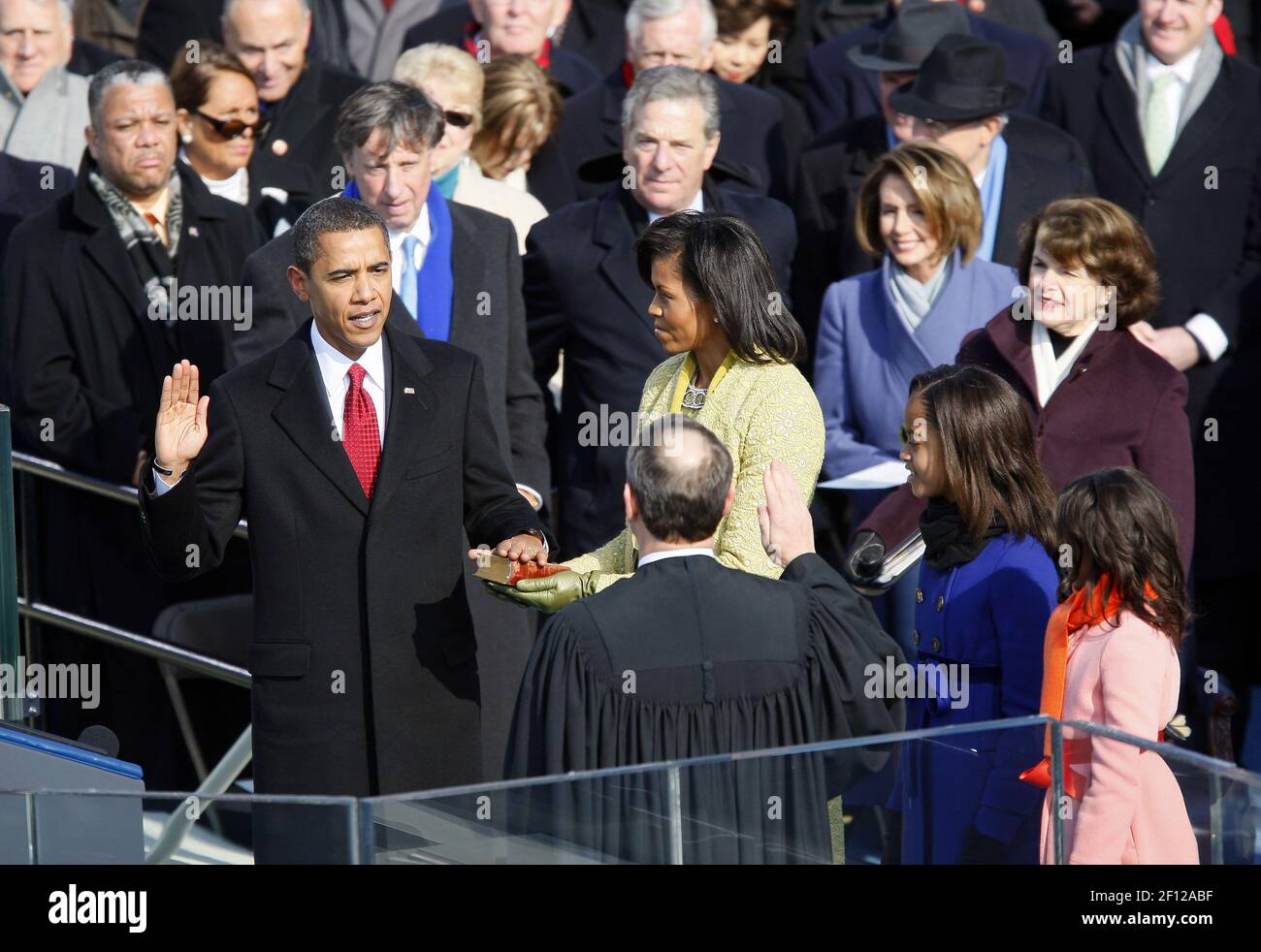 Barack Obama, left, takes the oath of office as the 44th U.S. President ...