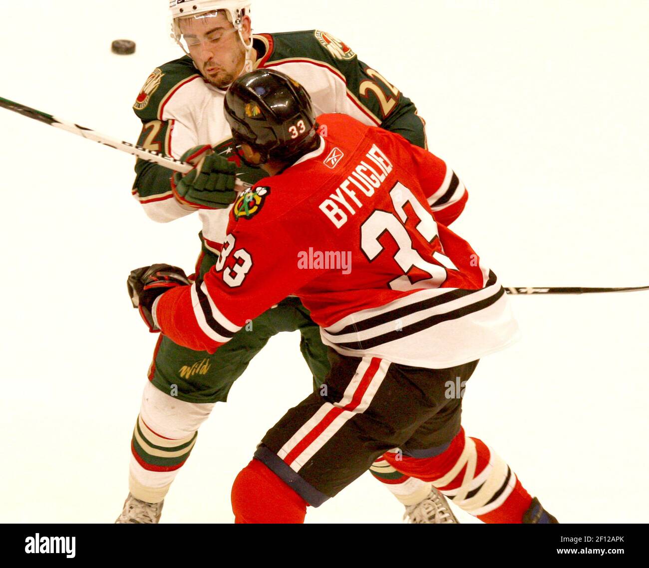 Chicago Blackhawks Dustin Byfuglien collides with the Minnesota Wild ...