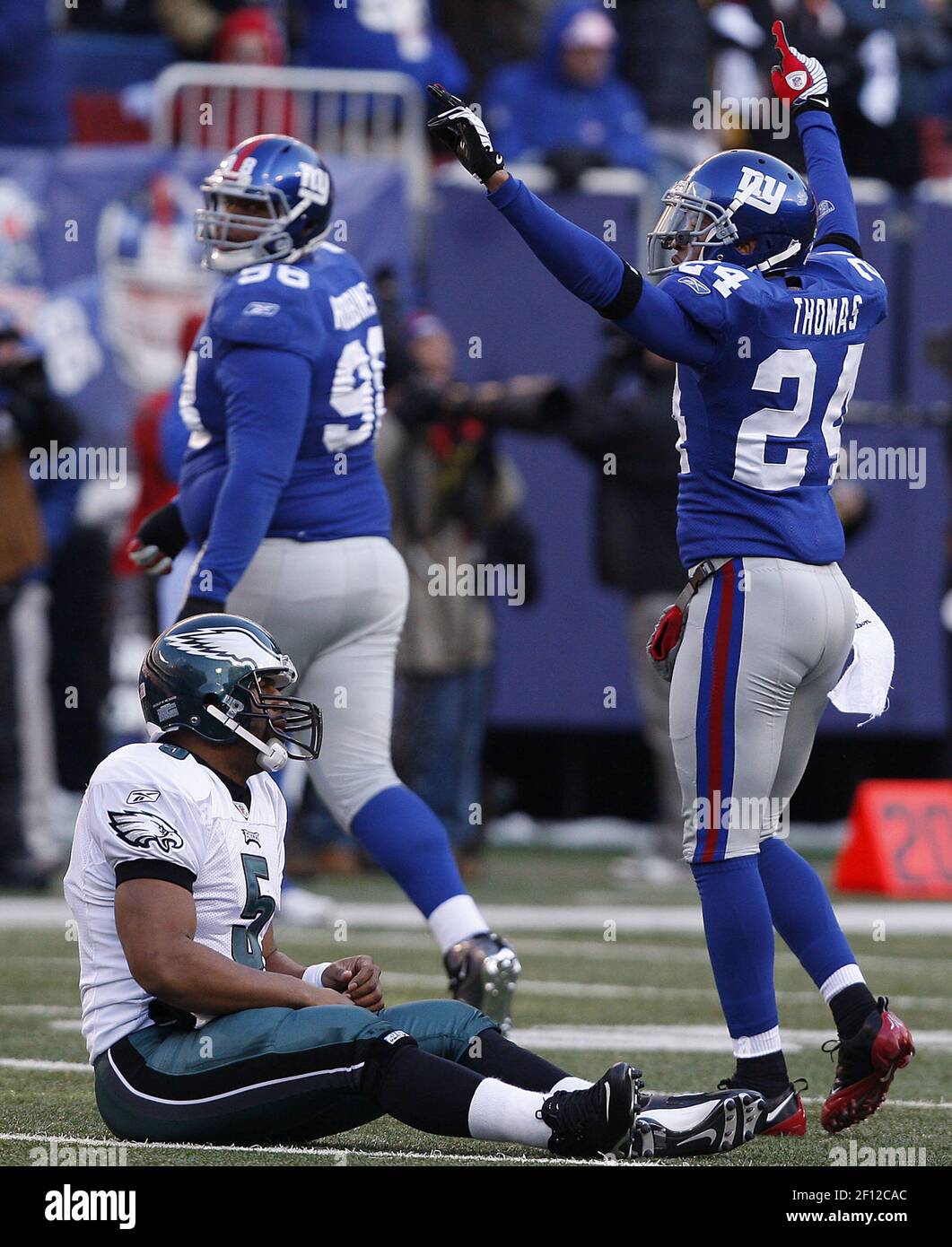 Philadelphia Eagles quarterback Donovan McNabb, left, sits on the field ...
