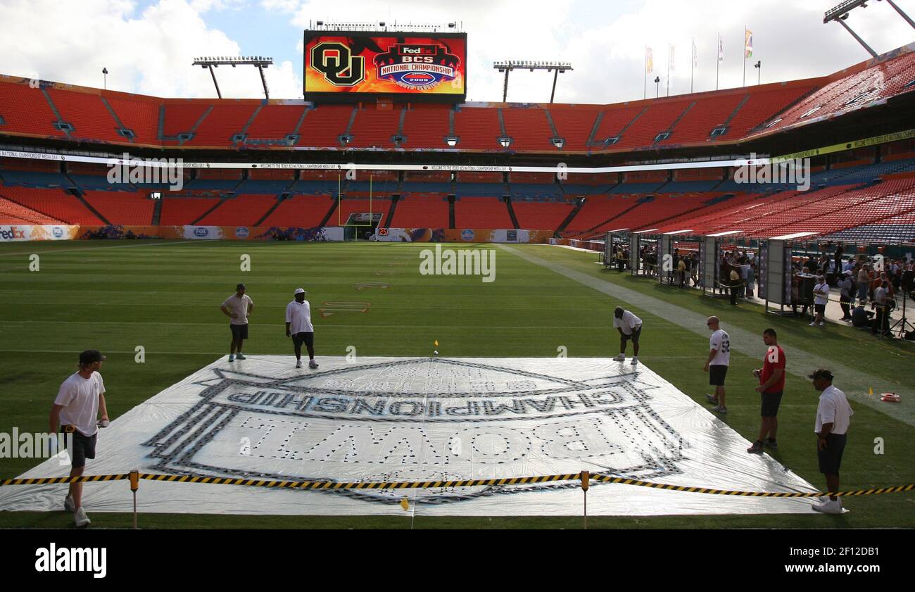 Workers at Dolphin Stadium in Miami, Florida, paint the field for the ...