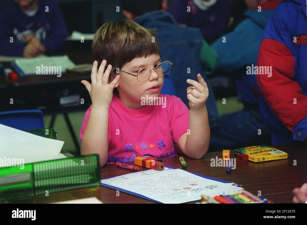 Rebeka Willett uses her fingers to solve addition problems for her math ...