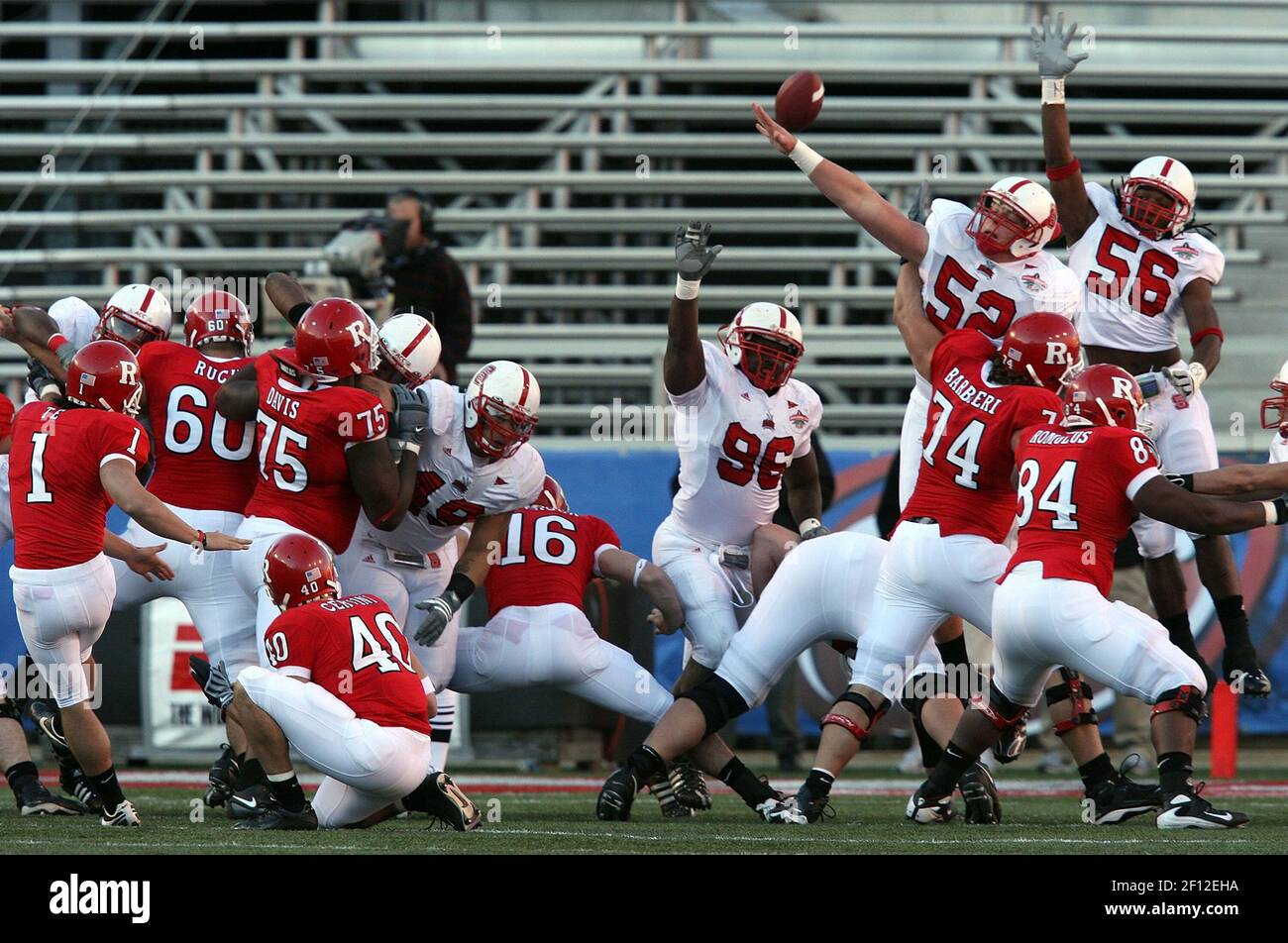 North Carolina State defensive end J.R. Sweezy (52) and linebacker Nate ...