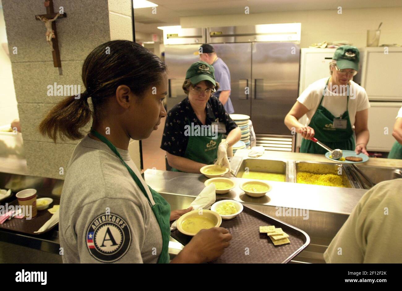 Latina Alston helps a guest at the Lord's Diner in Wichita, Kansas ...