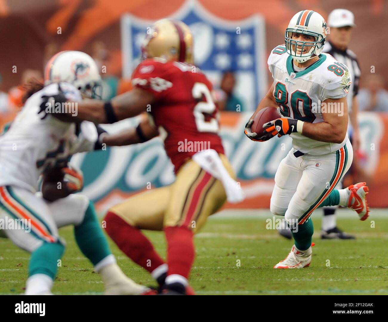 Miami Dolphins tight end Anthony Fasano heads up field with a fourth ...