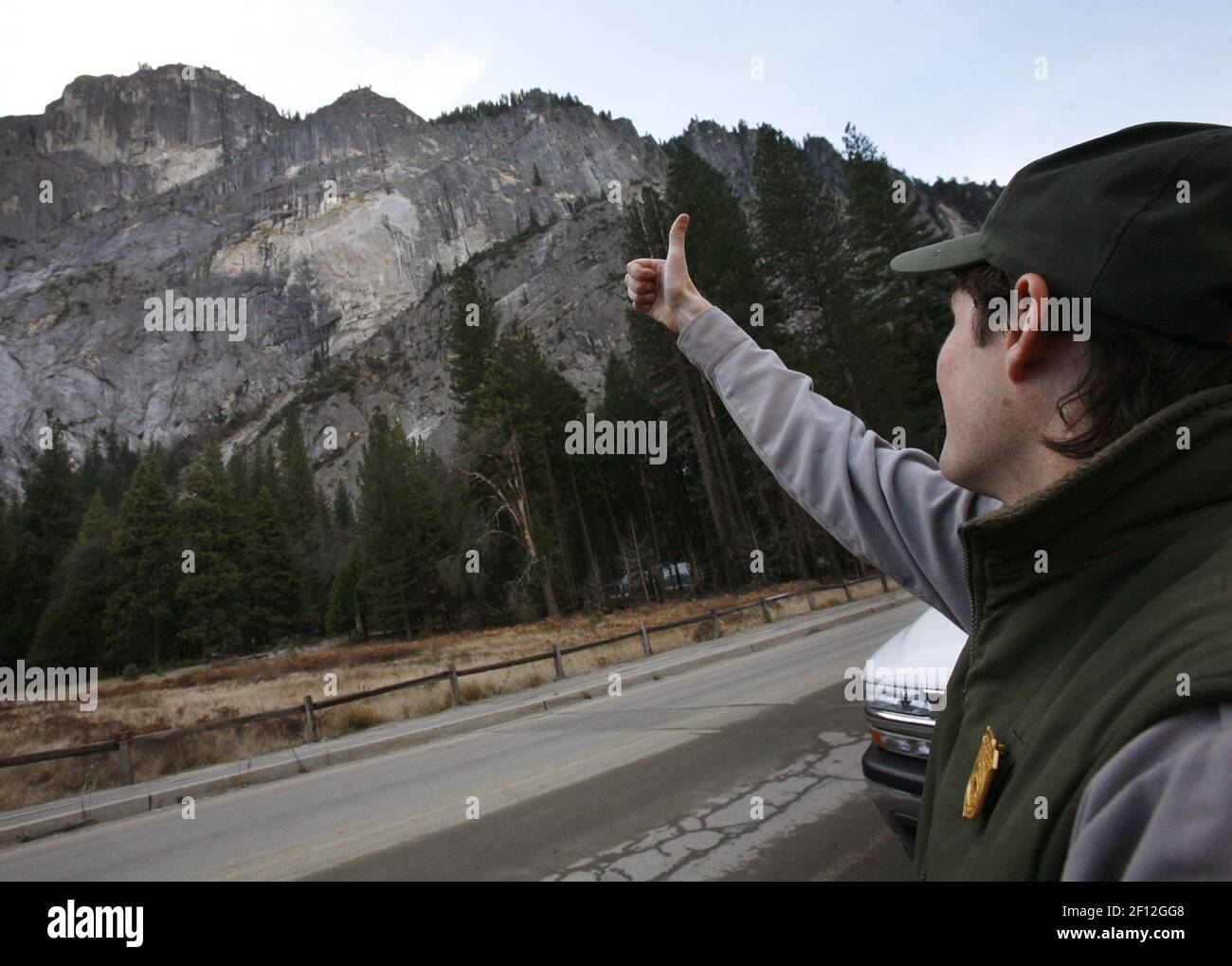 National Park Service geologist Greg Stock, Ph.D., points towards the ...