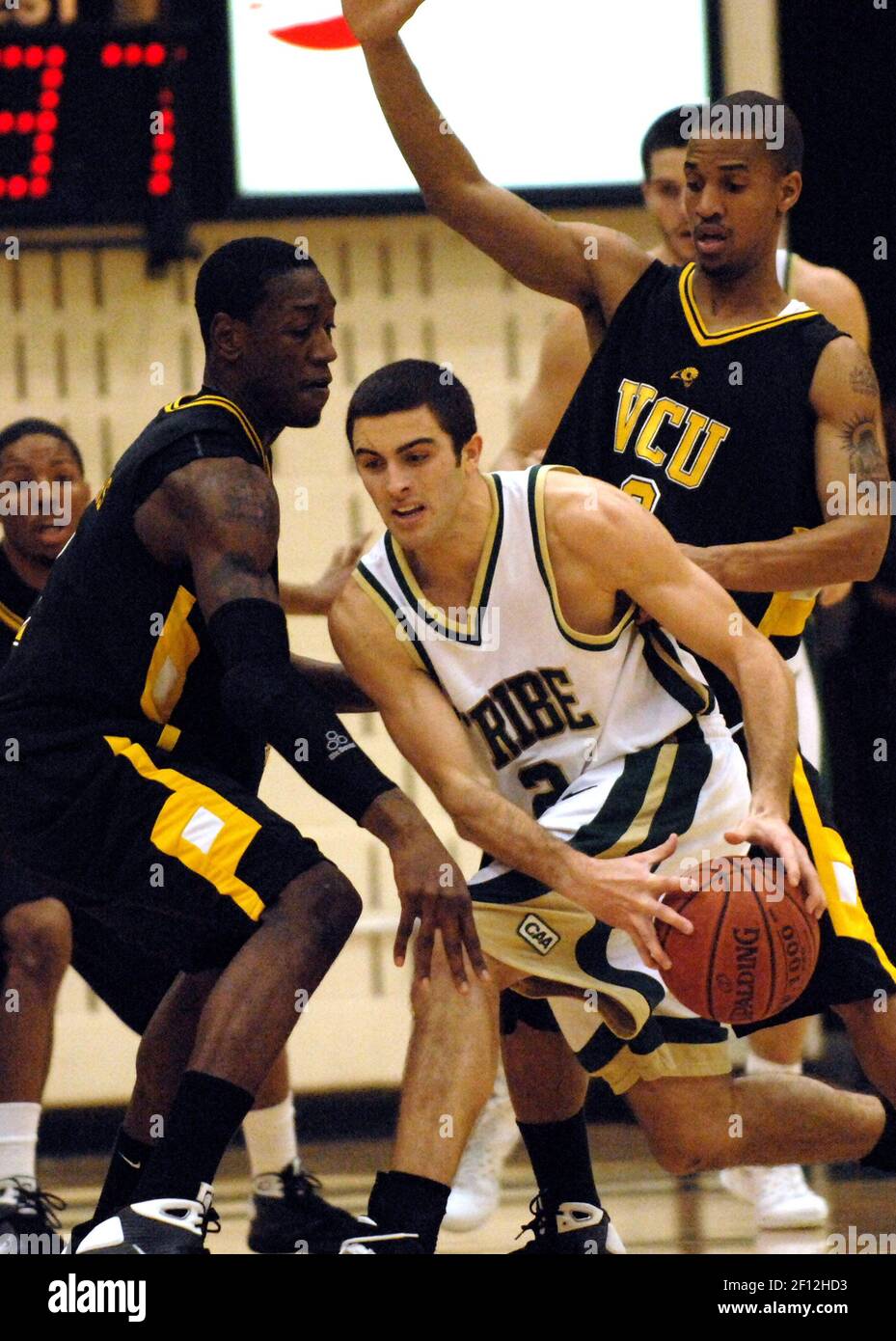William and Mary guard David Schneider (2) attempts to work out of a ...
