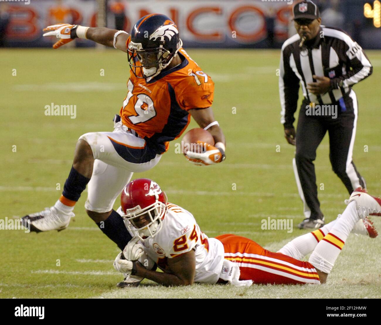 Denver Broncos wide receiver Eddie Royal tries to stay inbounds as he's ...