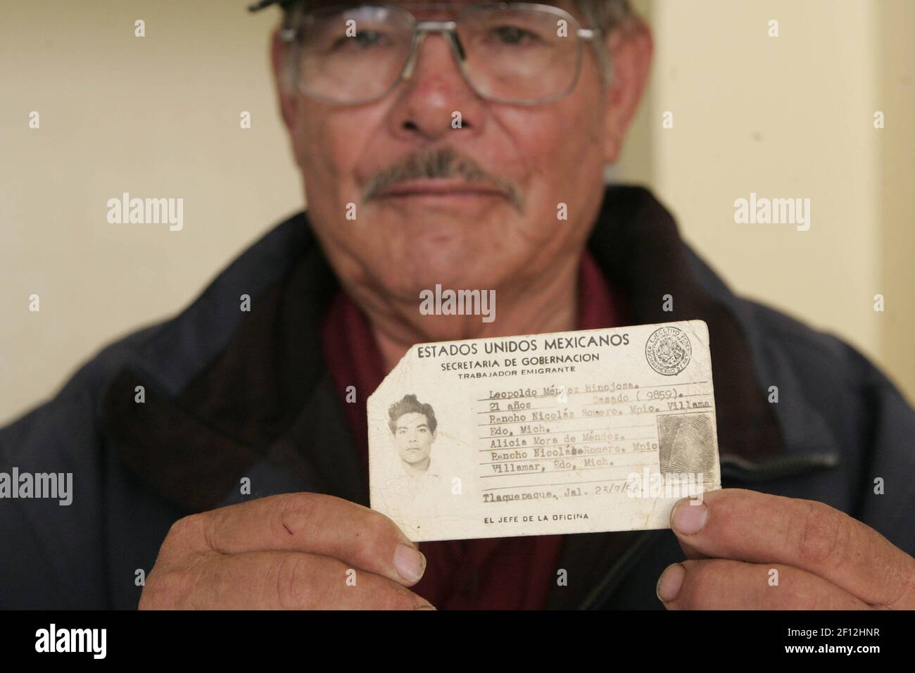 Fromer Bracero Leopoldo MÃ©ndez Hinojosa holds his Alien Laborer's ...
