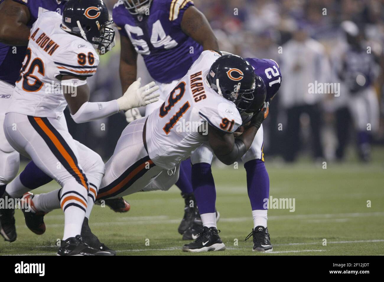 Chicago Bears Tommie Harris brings down Minnesota Vikings quarterback ...