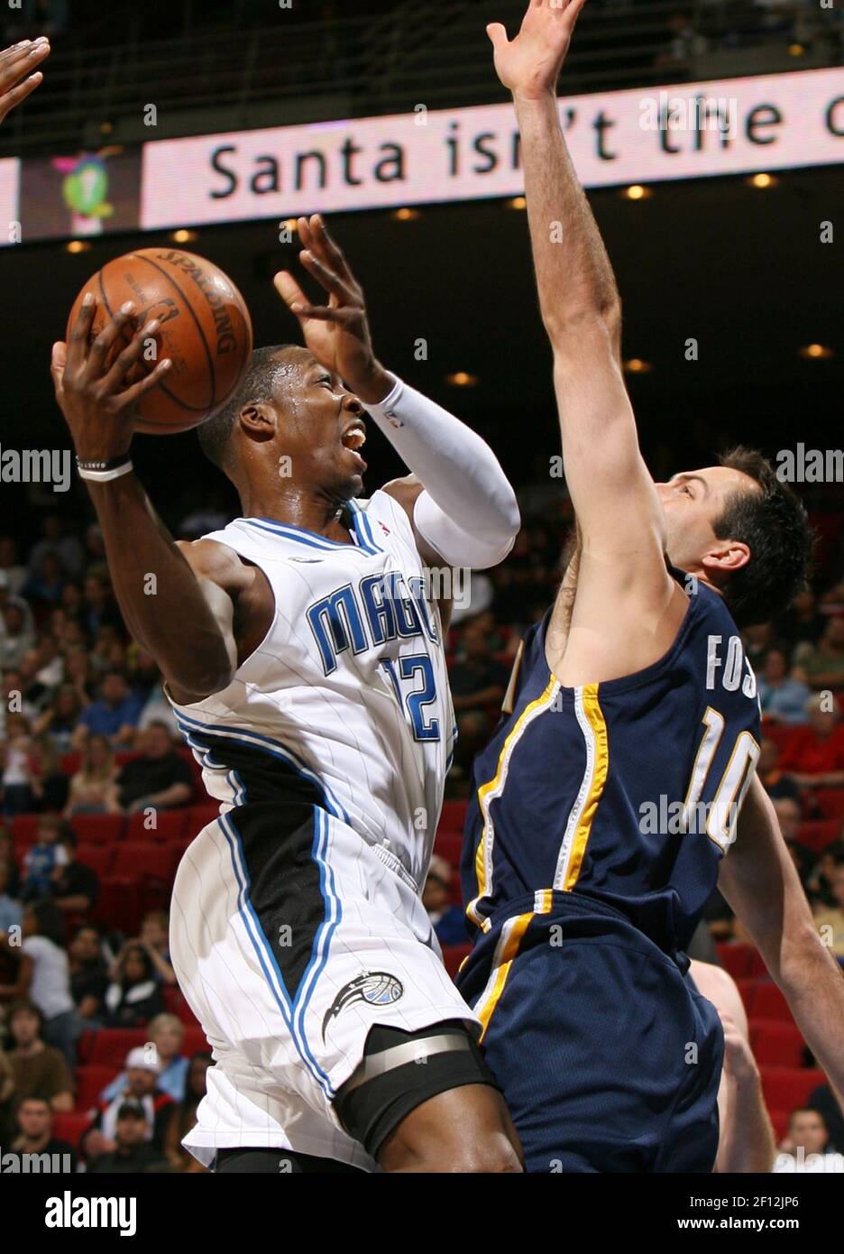 Orlando Magic center Dwight Howard drives past Indiana Pacers center ...
