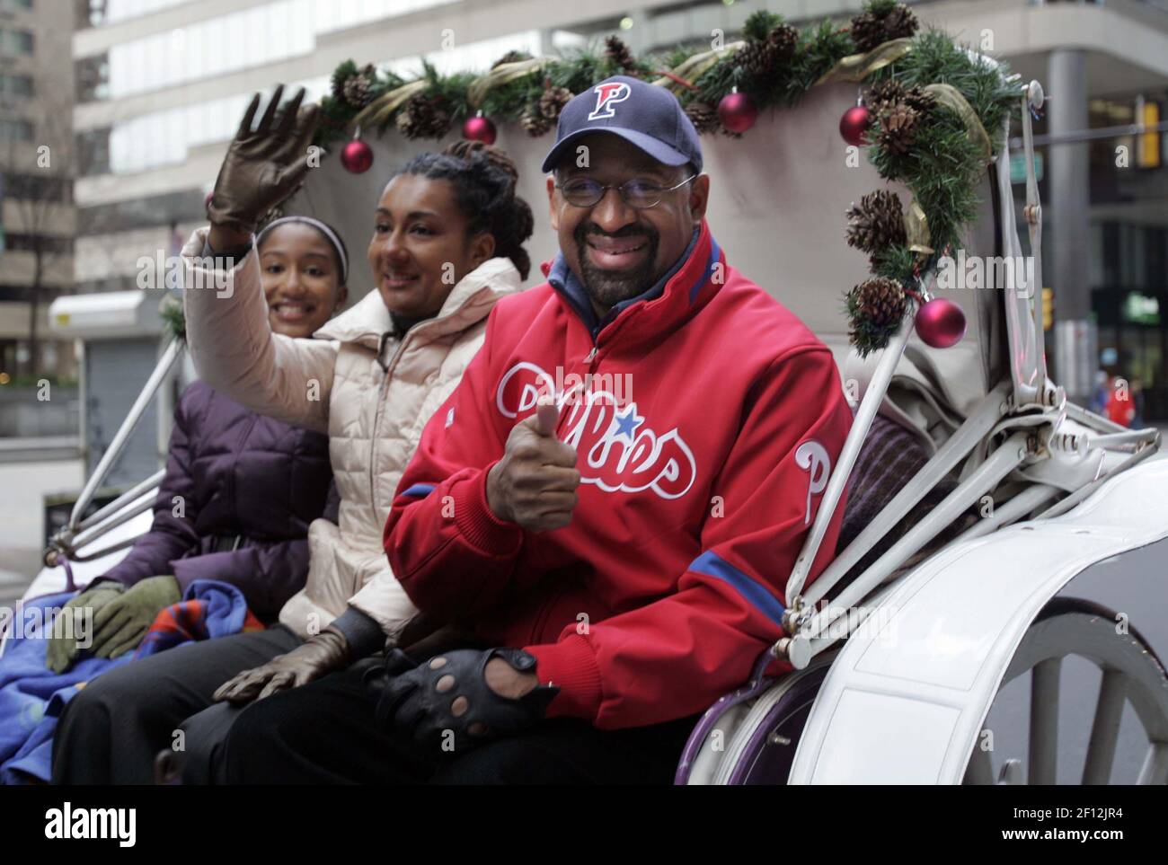 Philadelphia Mayor Michael Nutter and his family wave to the crowd on ...