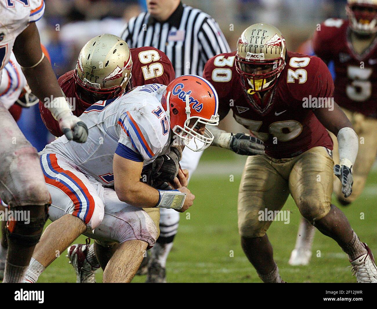 Florida quarterback Tim Tebow runs for a first down in the first ...