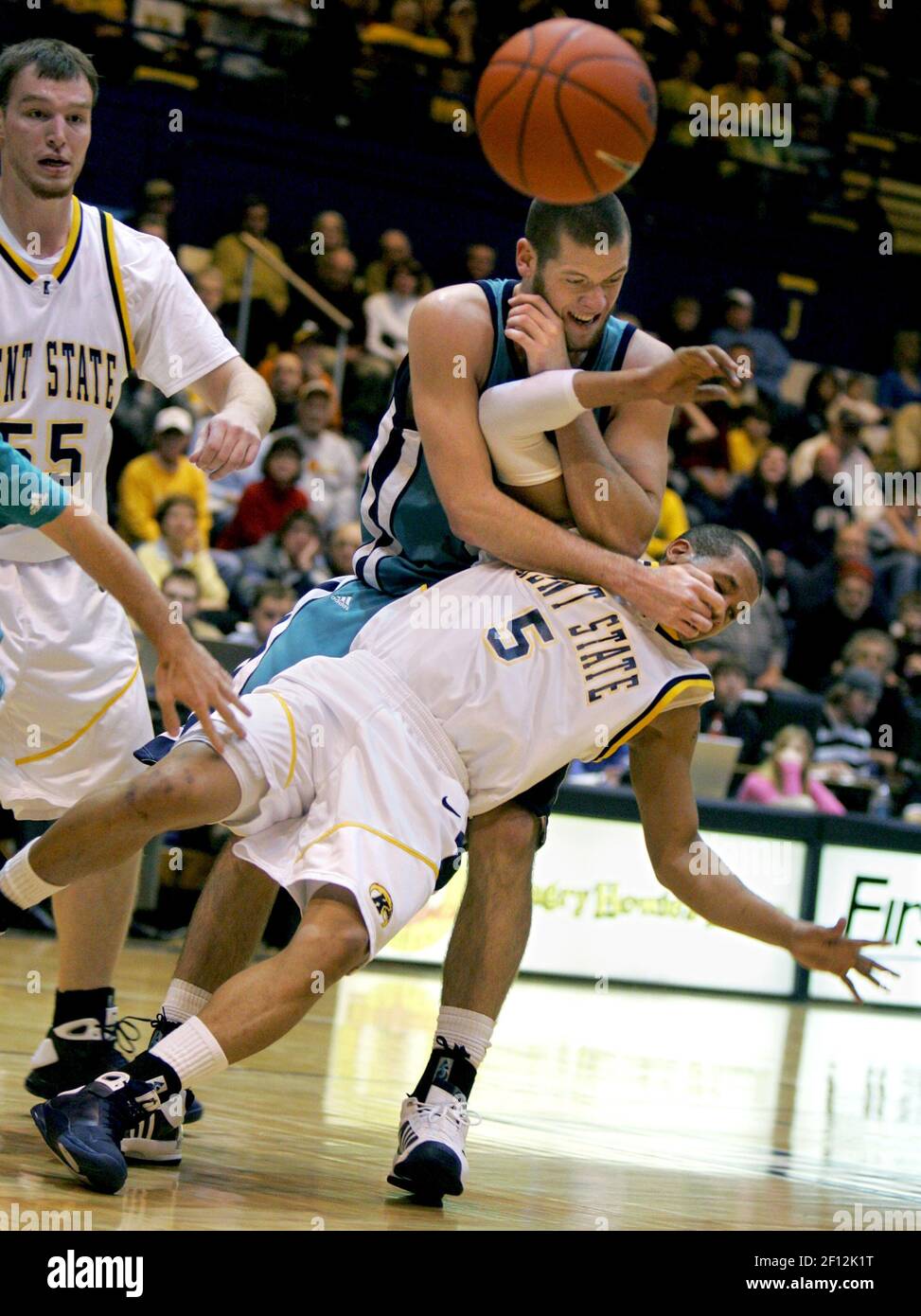 Kent State guard Al Fisher, right, is fouled by North Carolina ...