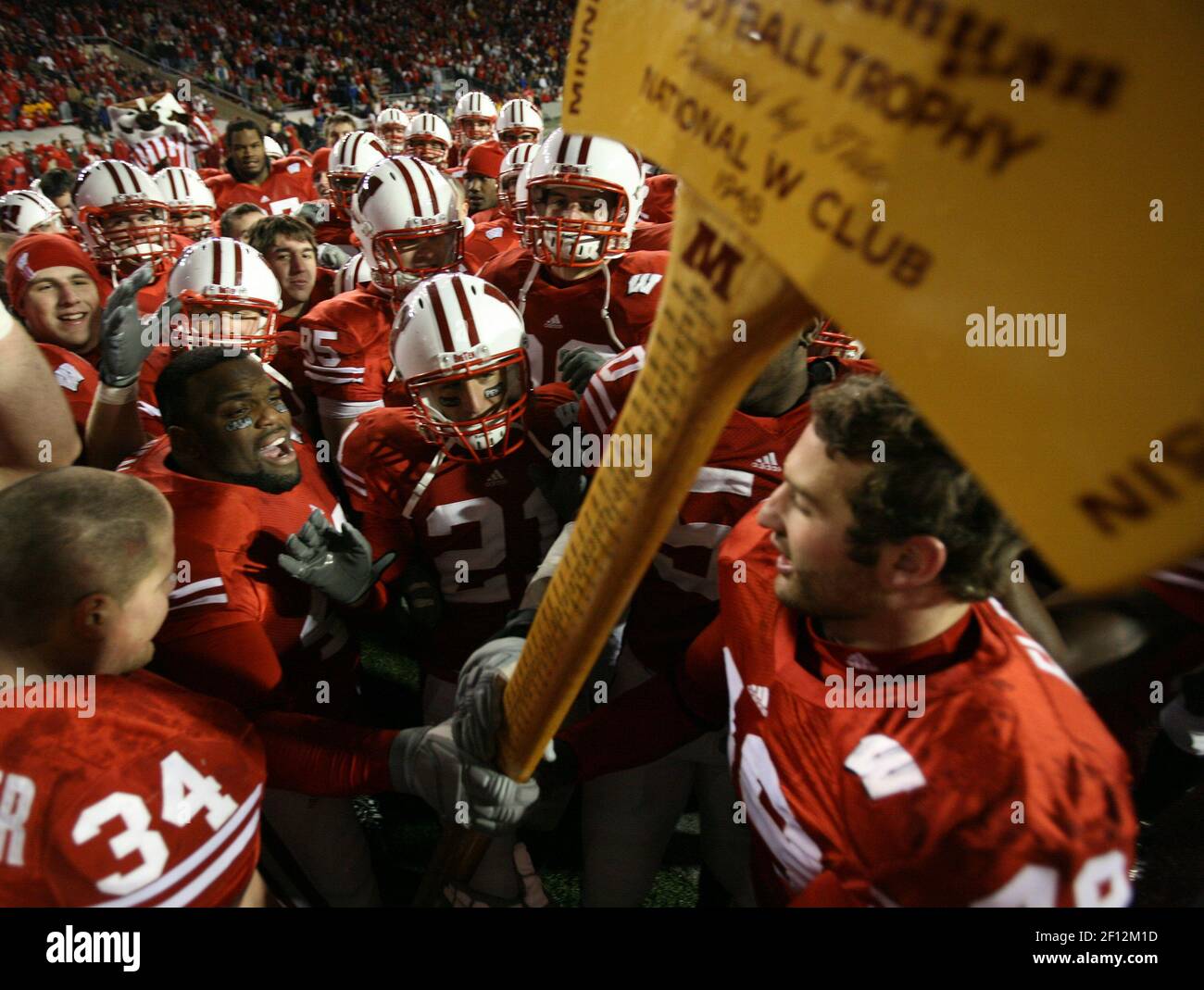 Wisconsin celebrates with the Paul Bunyan's Axe after defeating ...