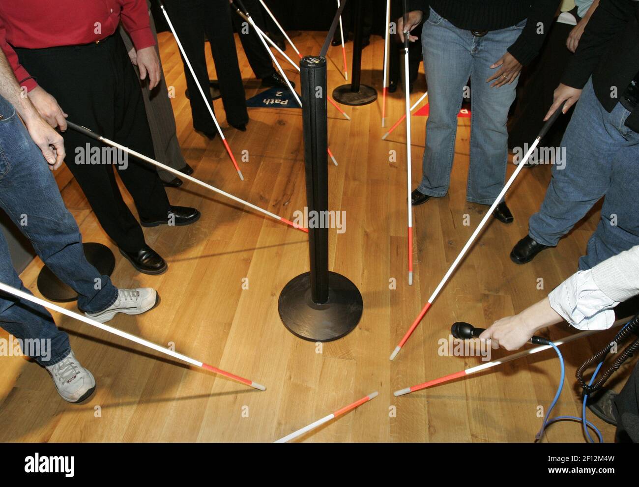 A radio reporter held out her microphone to capture the sound of ...