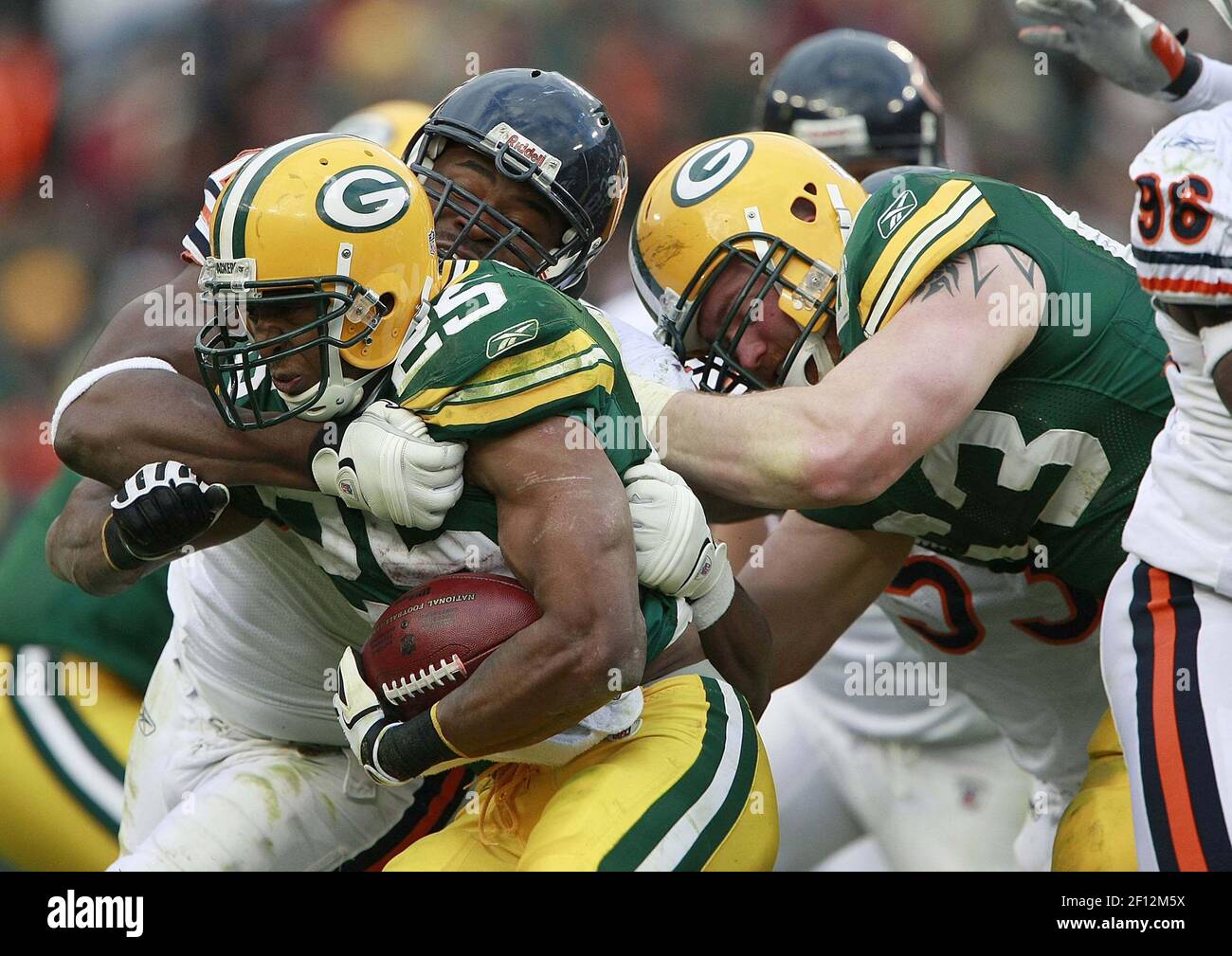 Green Bay Packers running back Ryan Grant (25) runs through the Chicago ...