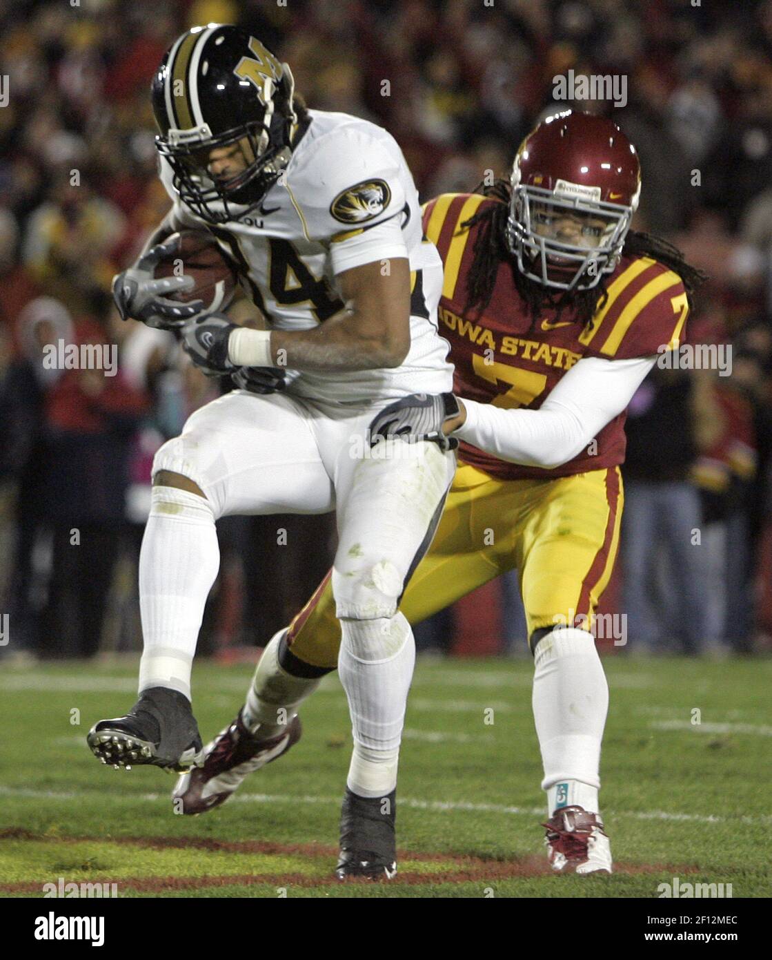 Missouri's Tommy Saunders (left) scores a first quarter touchdown ...