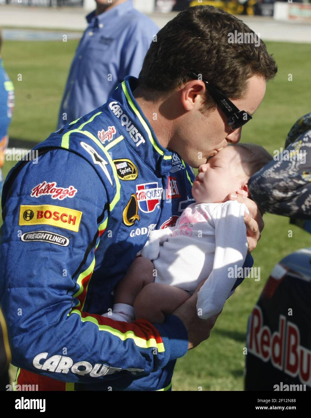 Casey Mears kisses his one-month-old baby before the start of the ...