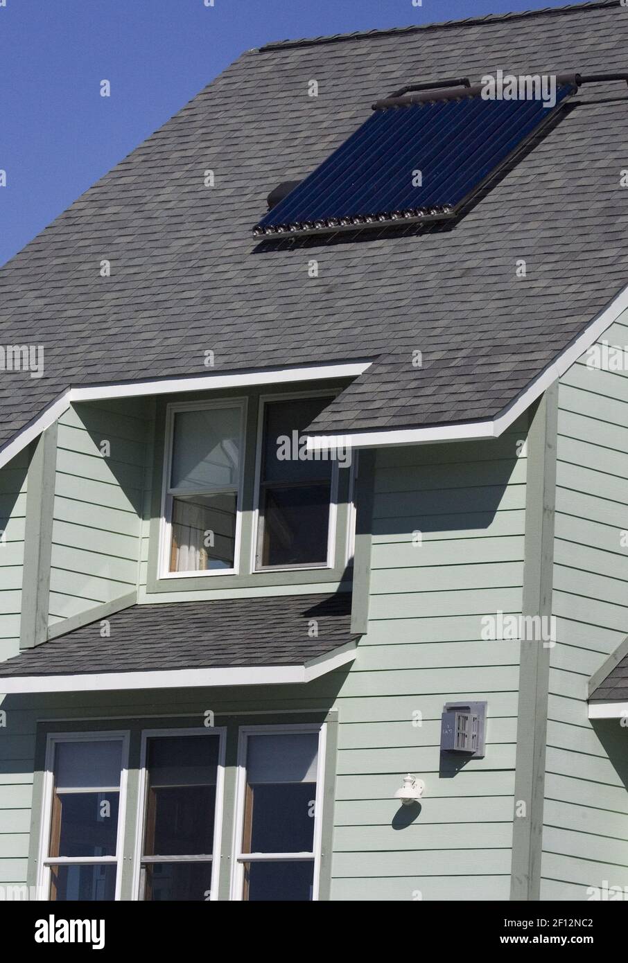 A solar panel provides about 60% of Ken Wright's annual hot water needs ...