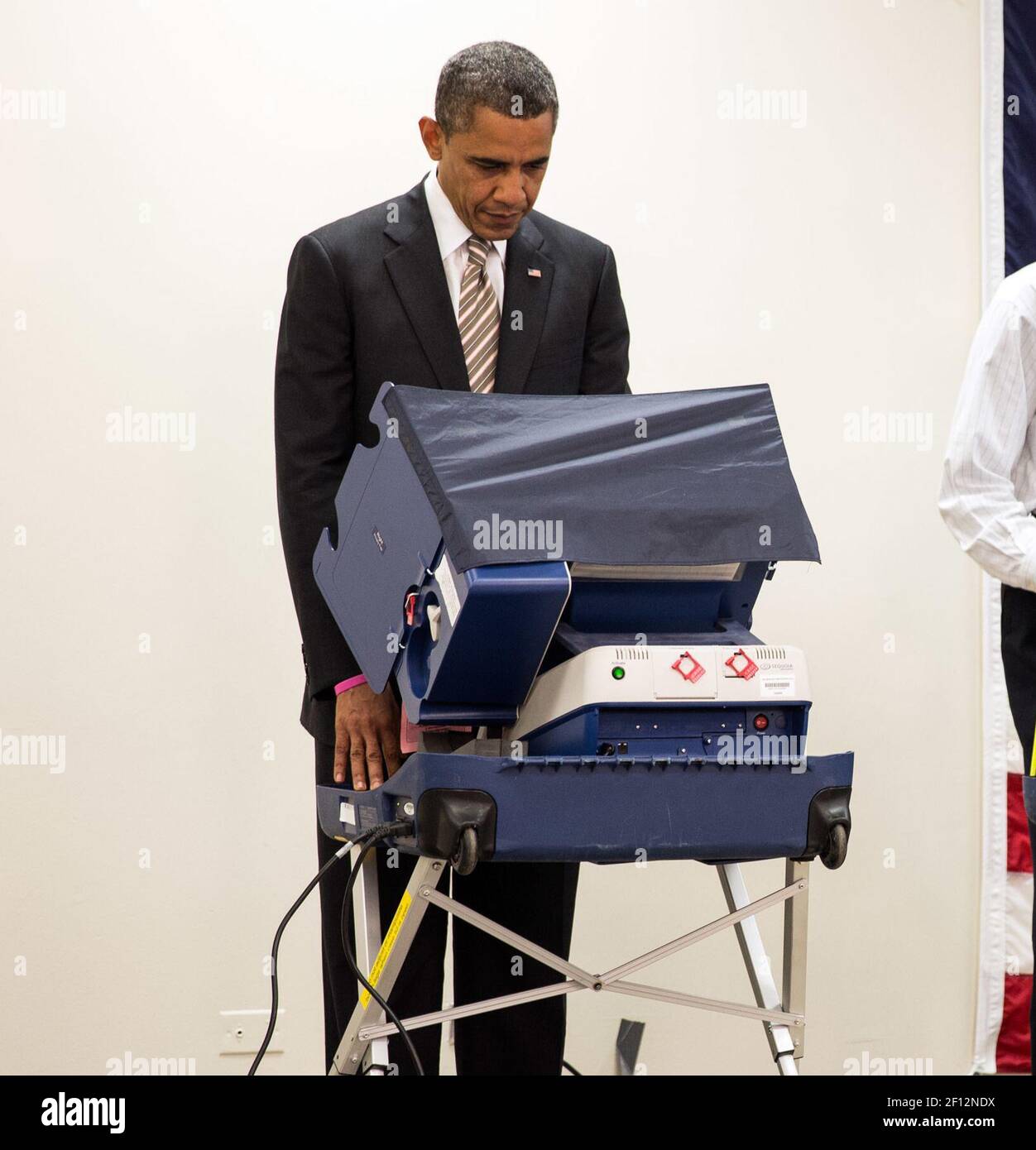 President Barack Obama casts his ballot during early voting at the ...