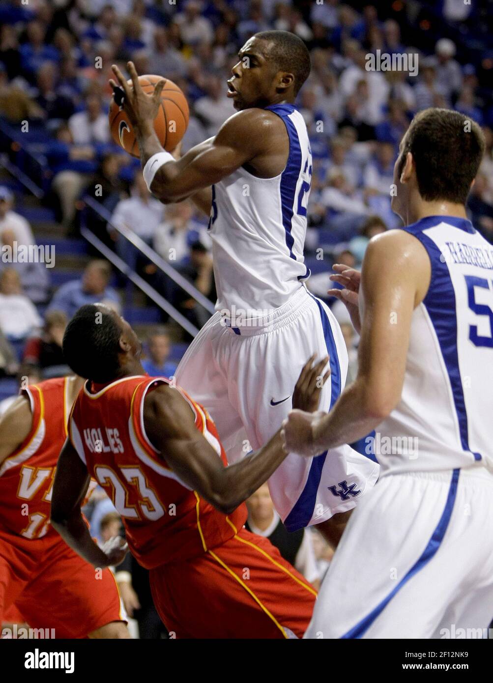 Kentucky's Jodie Meeks drew a foul on VMI's Travis Holmes as he drove ...