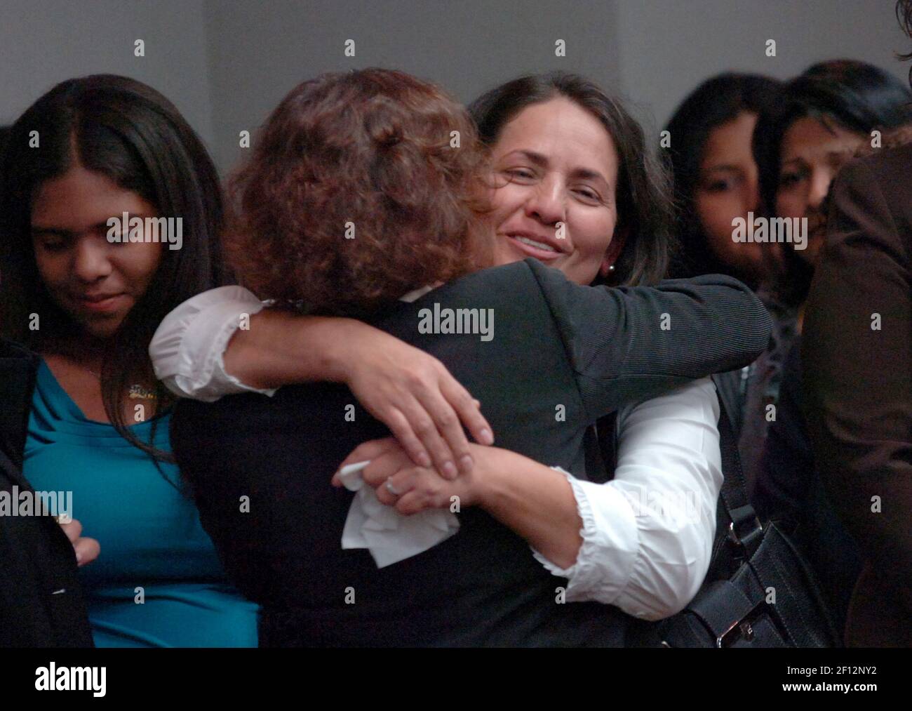 Maria Gough, center, hugs Carin Kahgan, at the end of the sentencing of ...