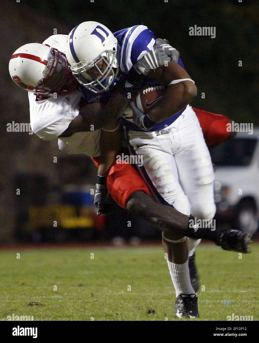 N.C. State's J.C. Neal leaps on Duke's Donovan Varner during the third ...