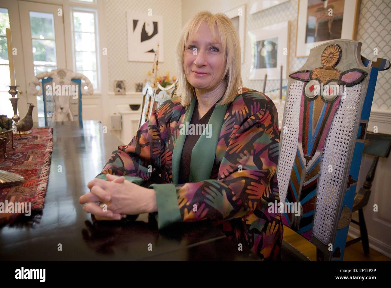 Elissa Topol, a crafts collector with an eclectic mix of antiques, sits ...