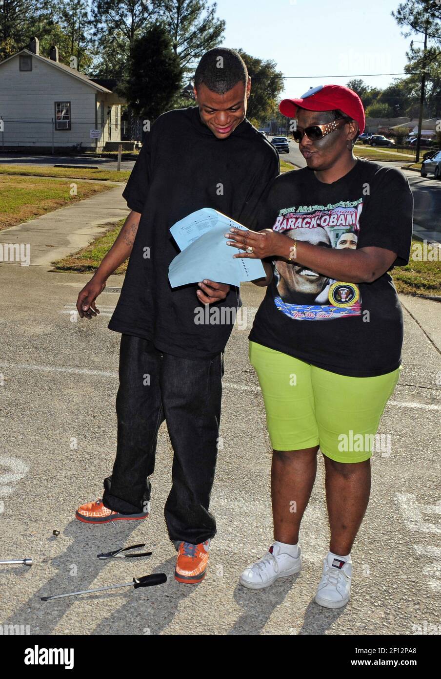 Marcus Tibbs takes a break from fixing his car in Bessemer, Alabama, to ...