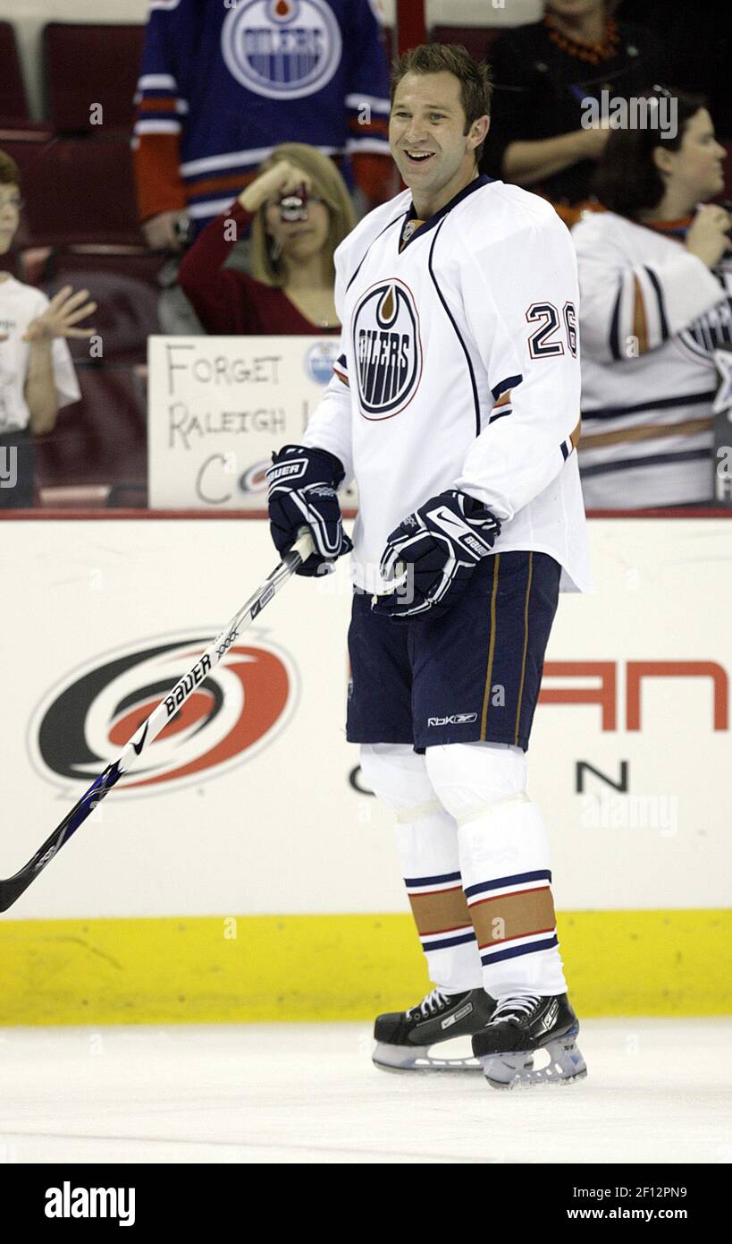 Edmonton Oilers' Erik Cole (26), a former Hurricane, flashes a smile ...