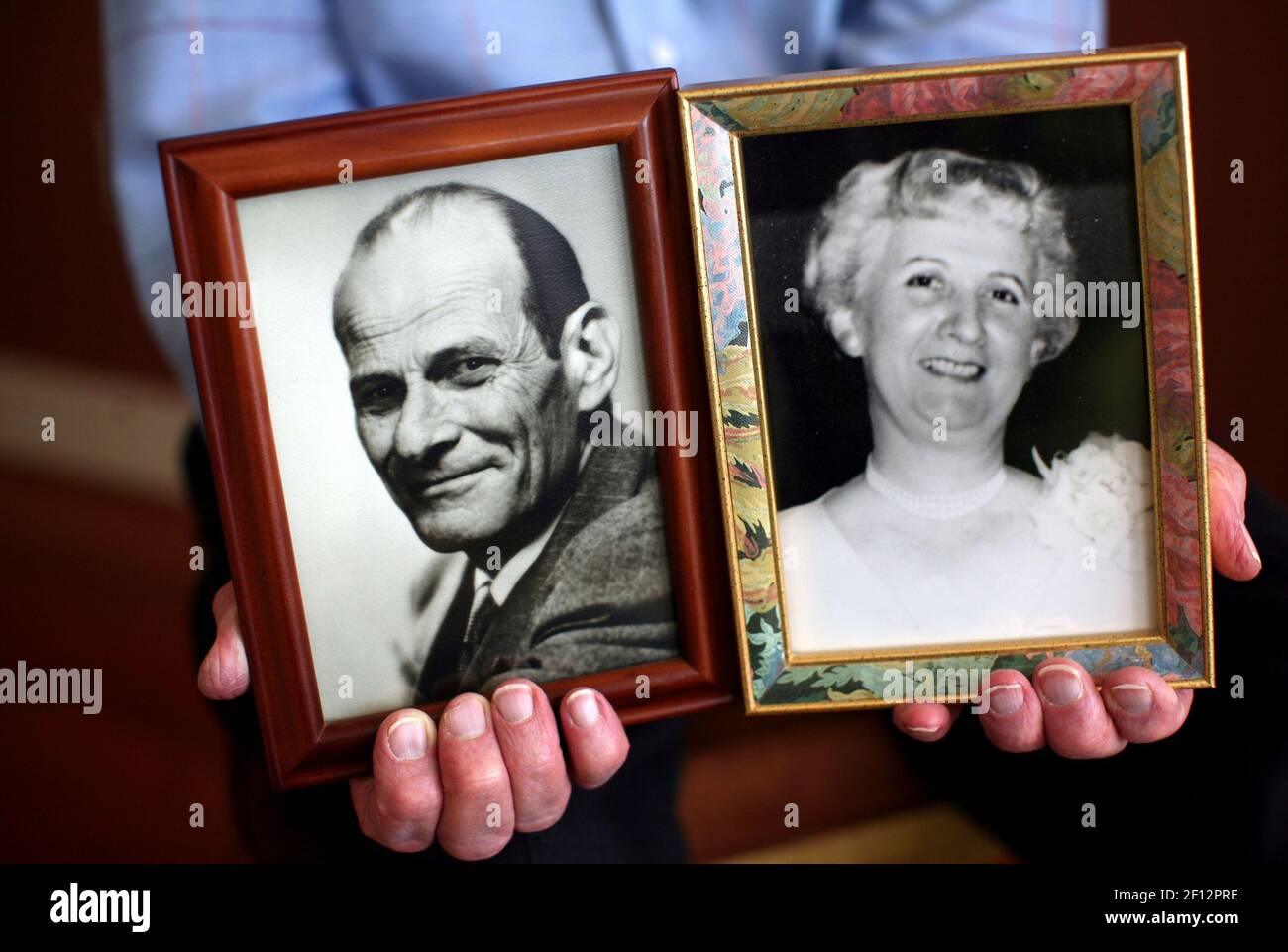 Barry Solomon holds photographs of his parents Ted, left, and Sadie ...