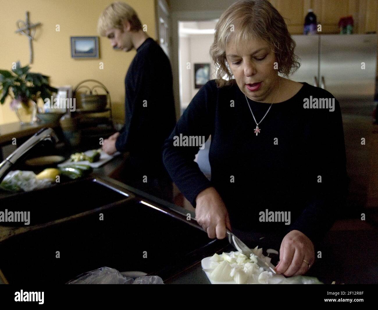 Kathy Wood, right, along with Luke Payne, 23, staying with her family ...