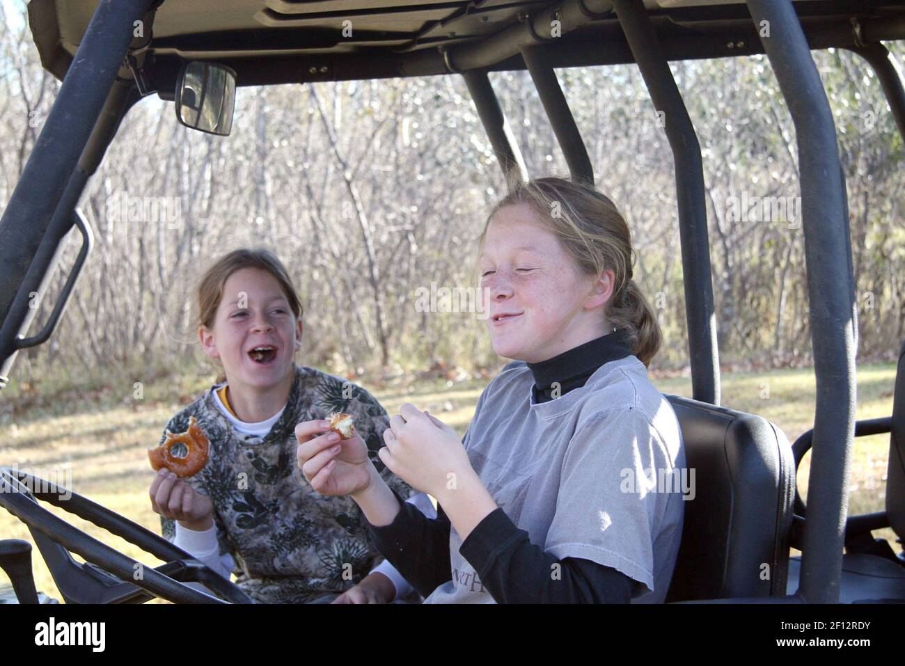 Holly Davis, left, shares laughs and donuts with her sister, Hailey ...