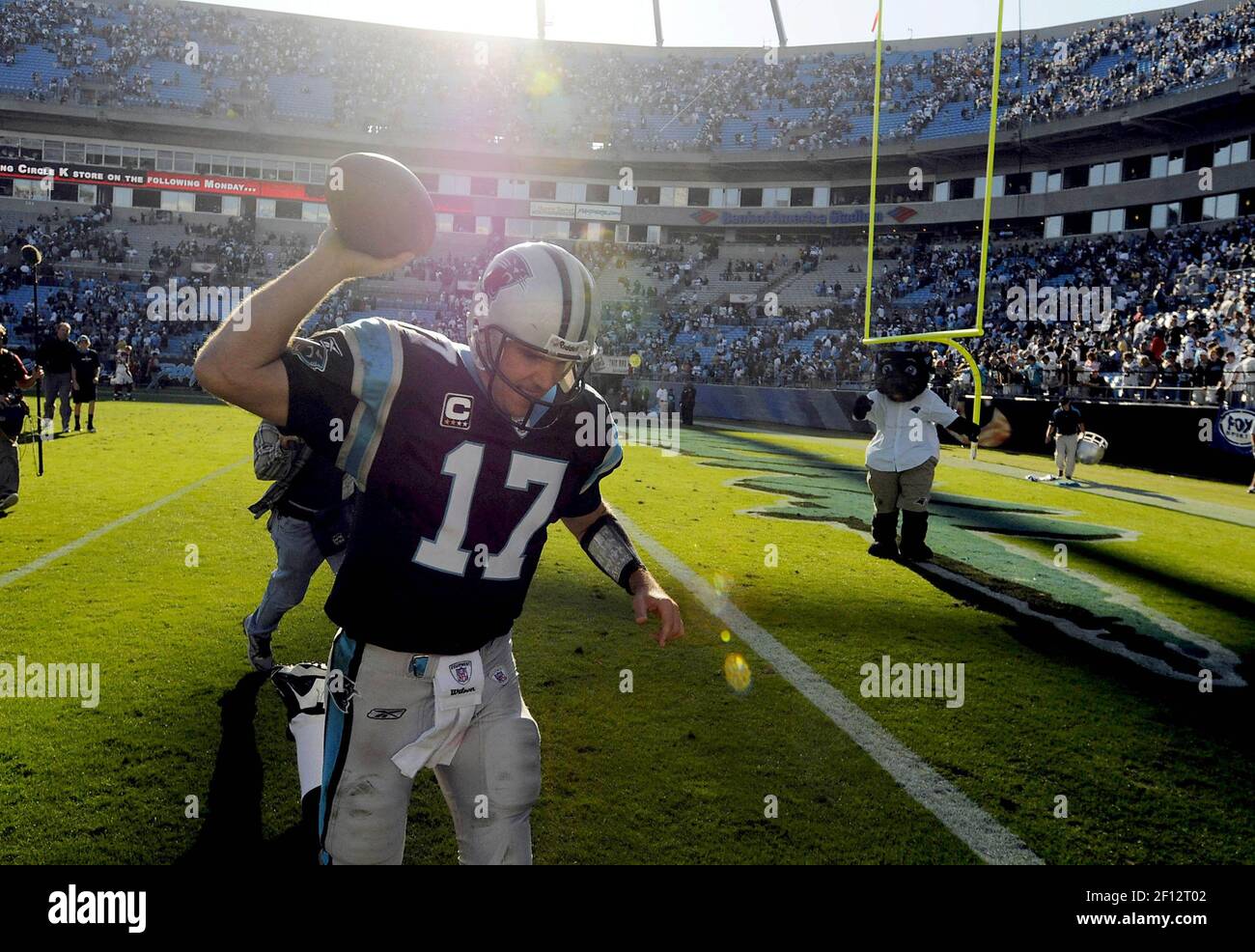 Carolina Panthers' Jake Delhomme (17) raises the ball while walking off ...