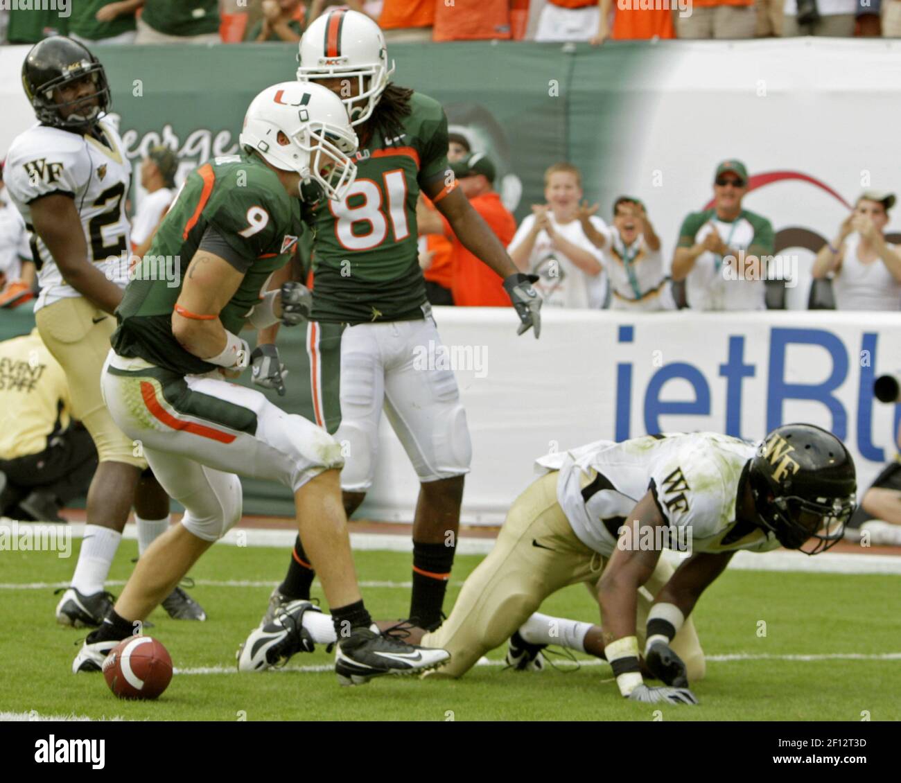 Miami's Robert Marve (9) celebrates over Wake Forest defender Alex Frye ...