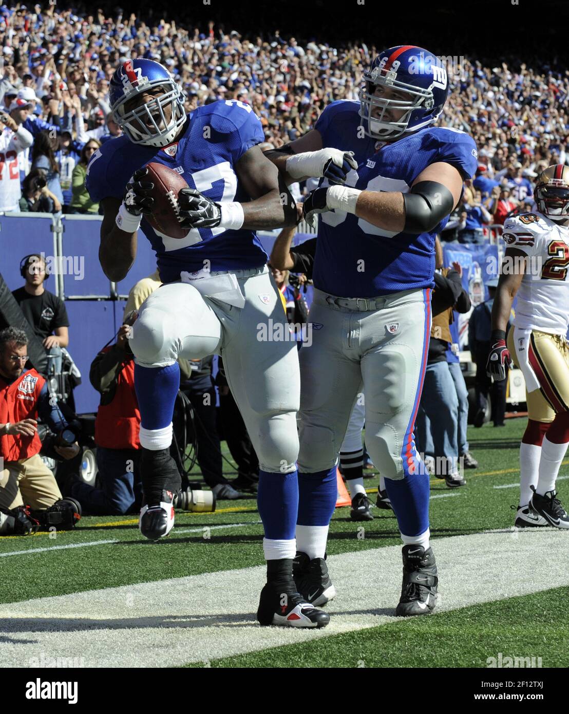 New York Giants Brandon Jacobs, left, and Rich Seubert celebrate Jacobs ...