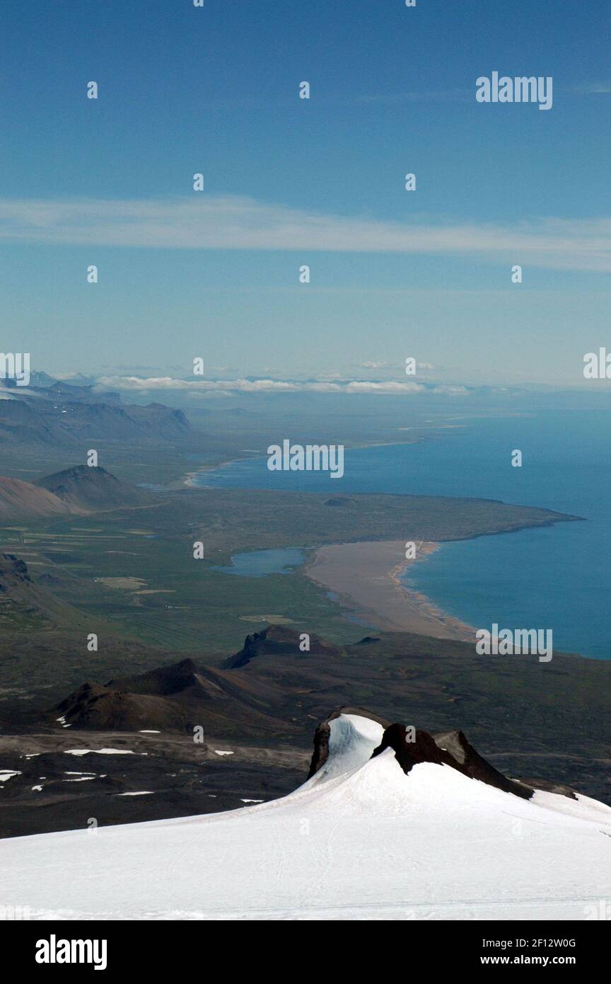 The Icelandic coast can be seen from the fast-melting Snaeffelsjokull ...