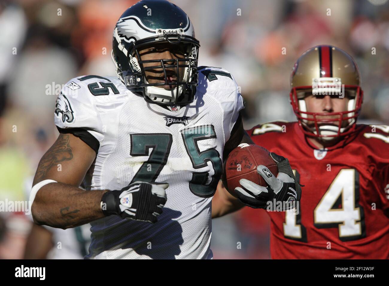 Philadelphia Eagles' Juqua Parker returns an interception for a ...