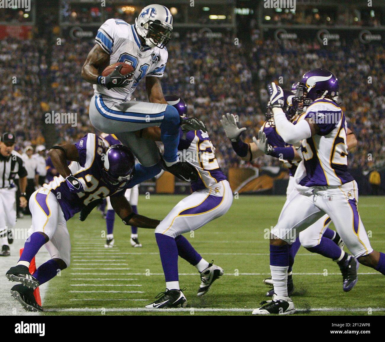 Detroit Lions receiver Calvin Johnson jumped over Minnesota Vikings ...