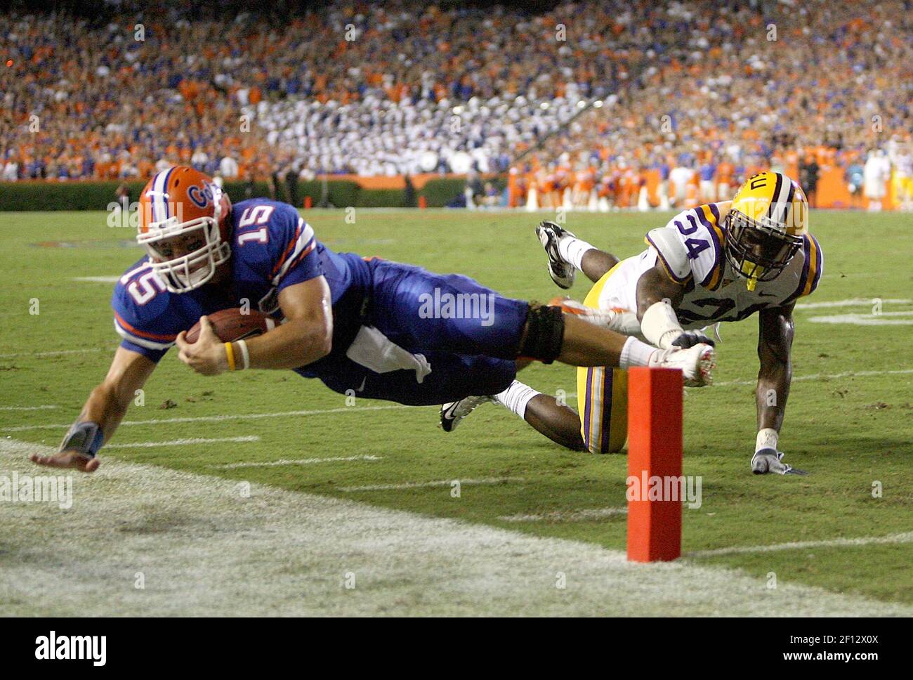 Florida quarterback Tim Tebow (15) is knocked out of bounds near the ...