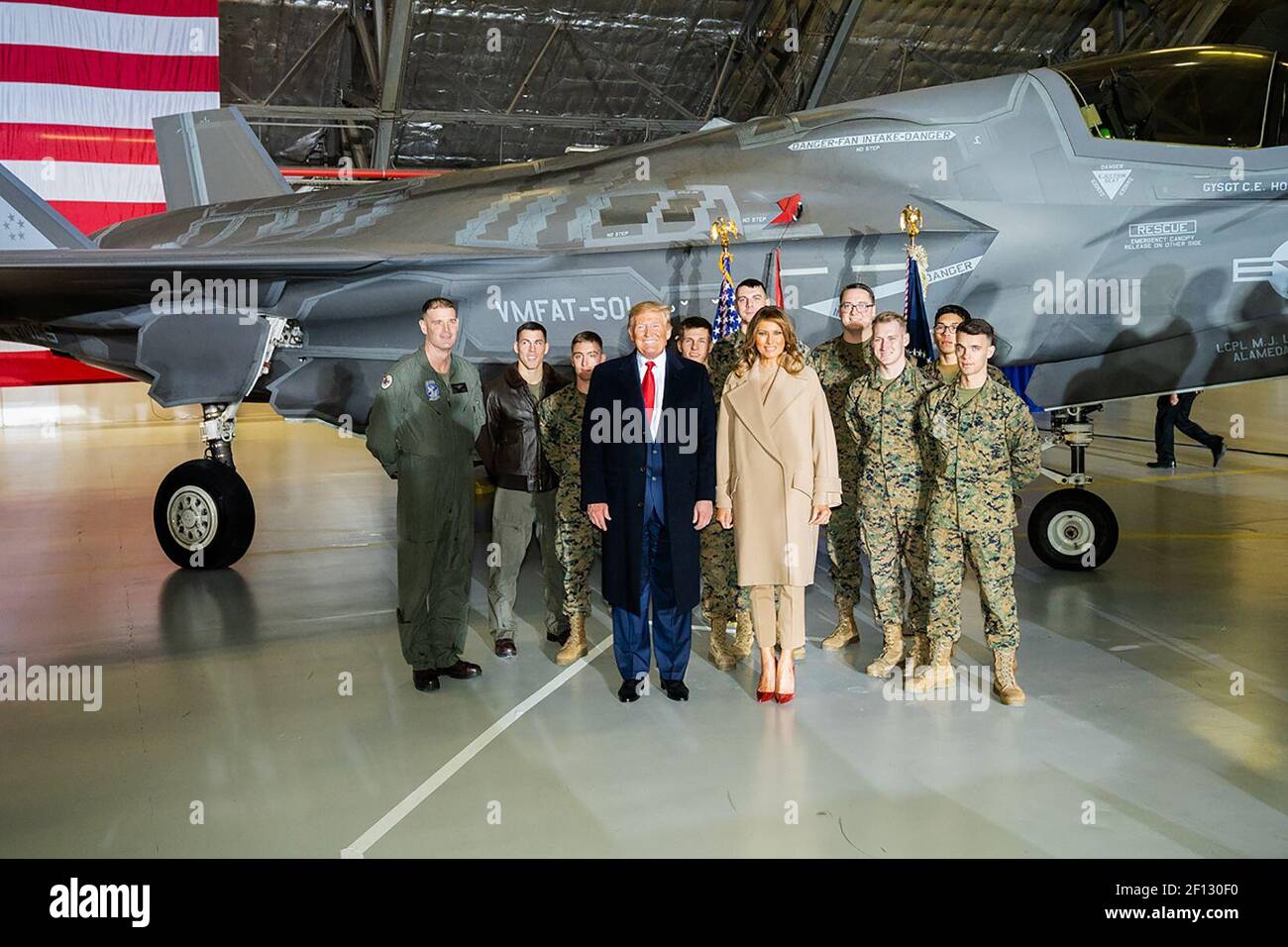 President Donald Trump and First Lady Melania Trump pose for a photo ...