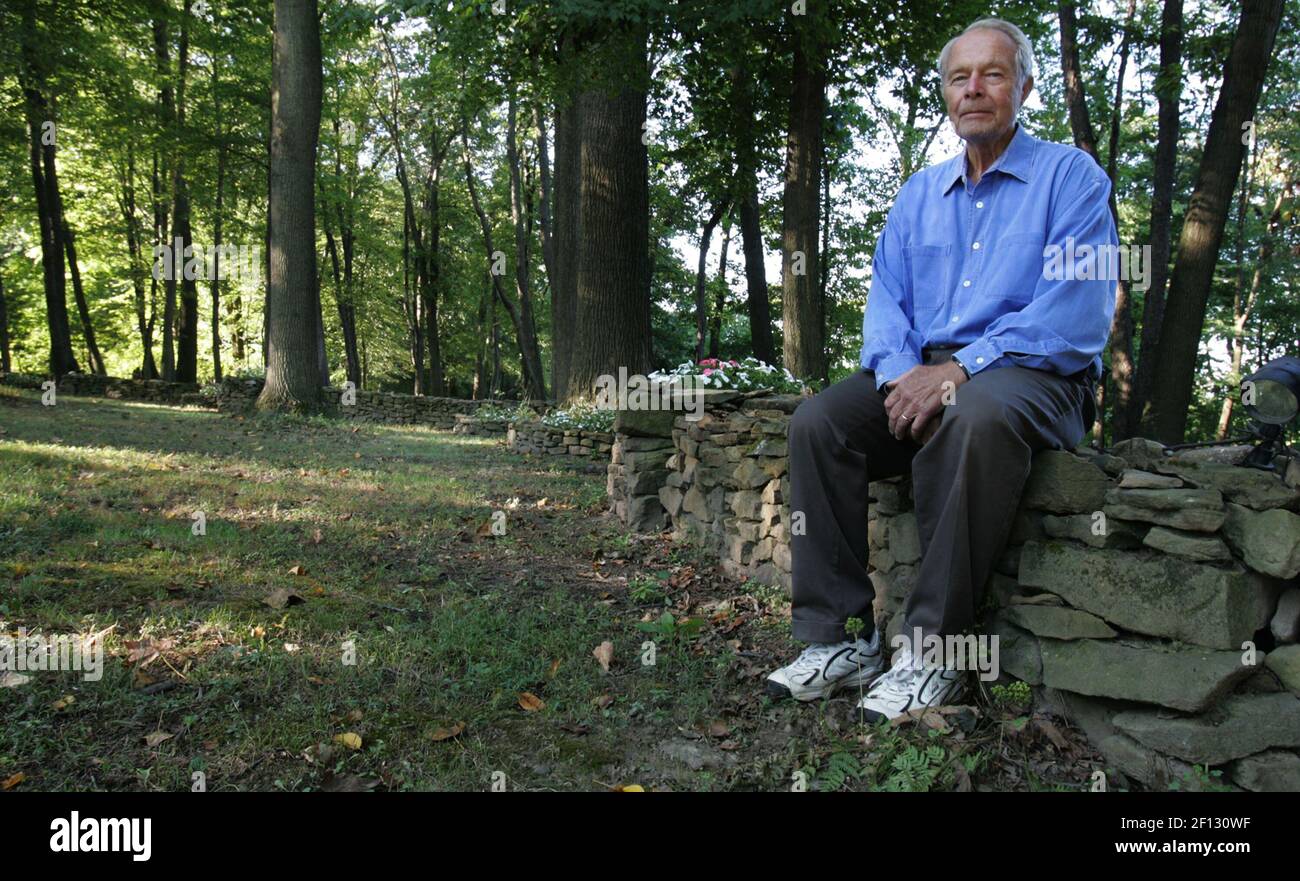 Retired neurosurgeon Dr. Richard Zahn, 74, sits on his stonewall ...