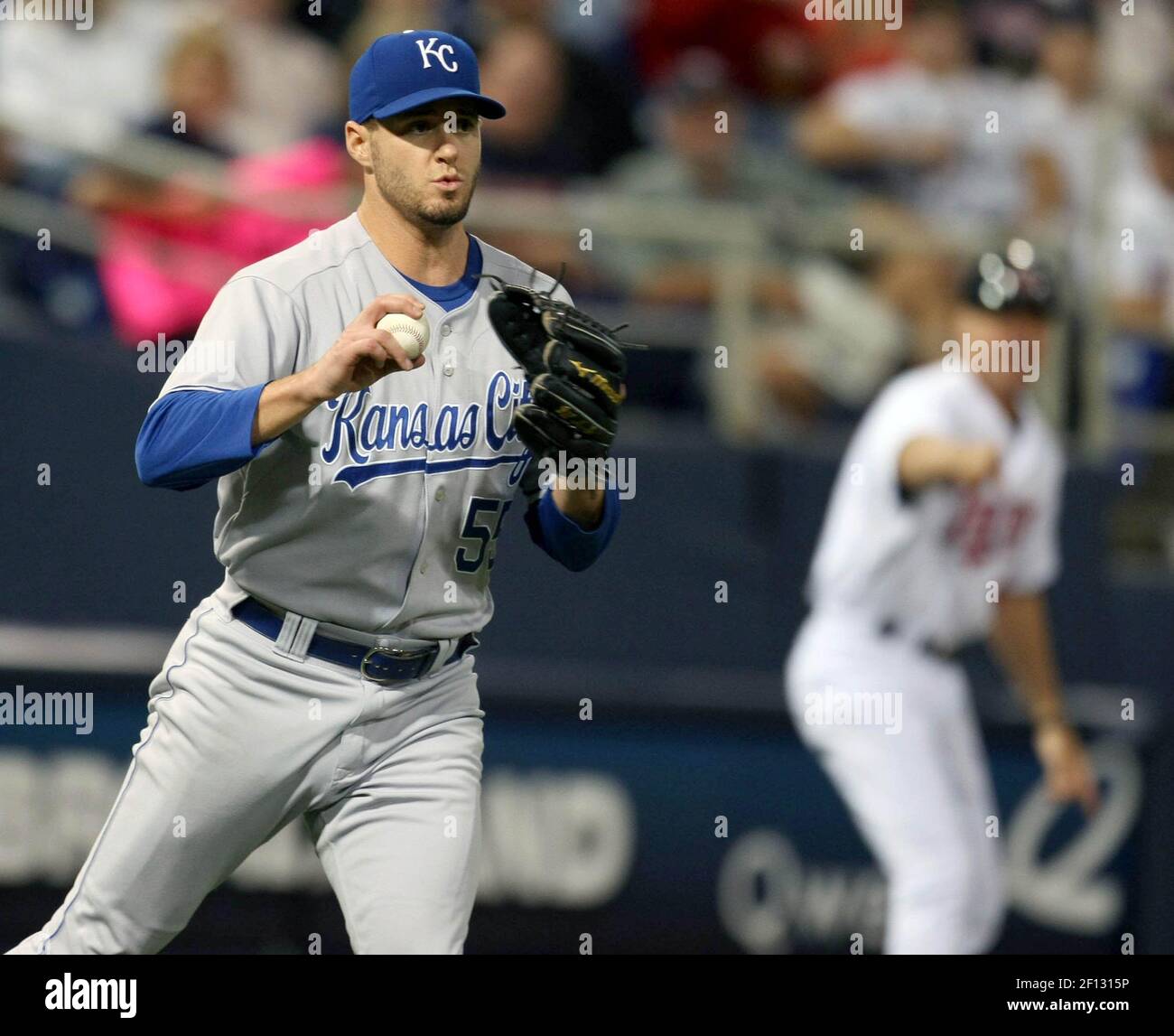 Kansas City Royals pitcher Gil Meche hesitates to throw the ball to ...
