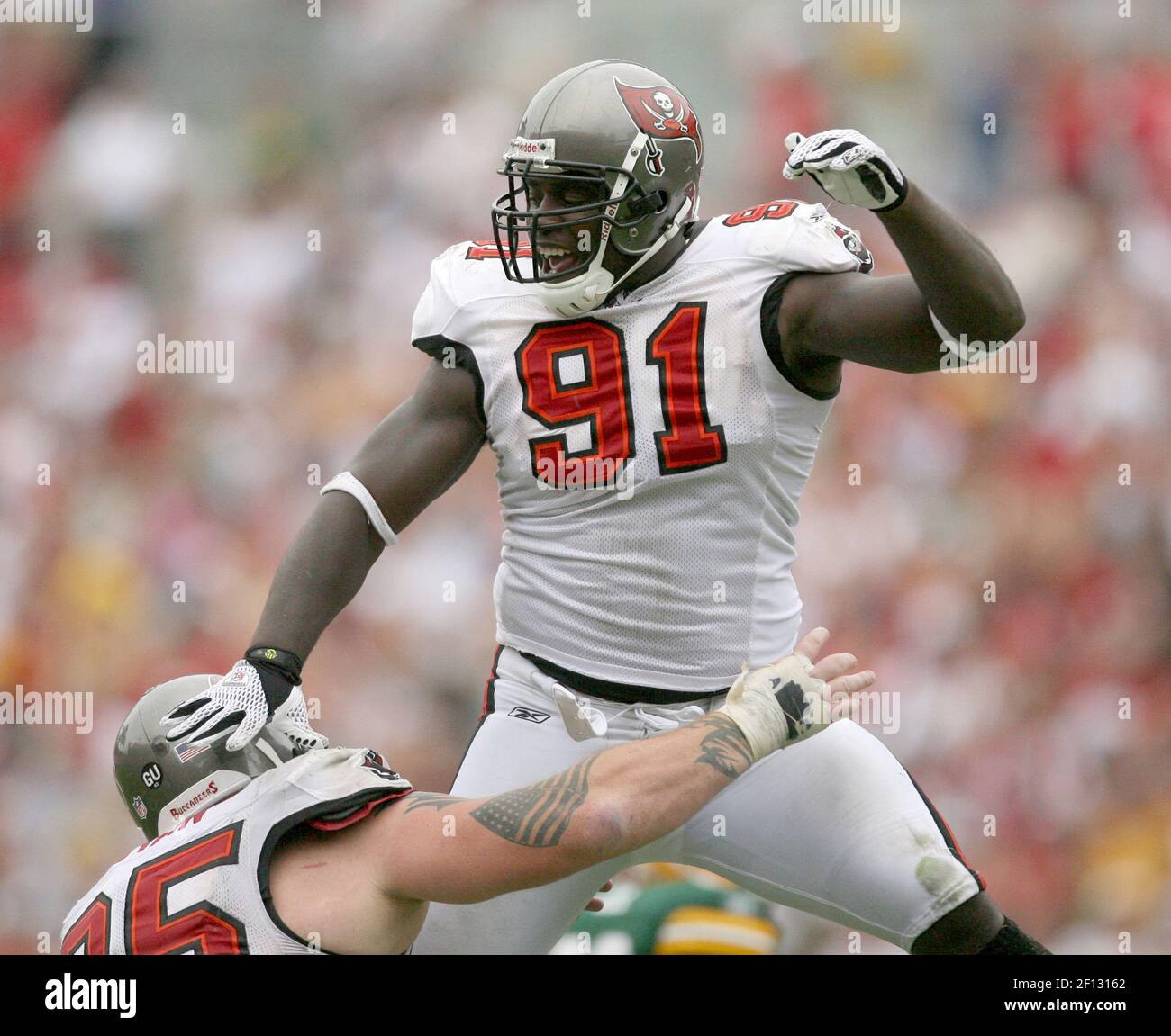 Tampa Bay Buccaneers defensive end Greg White (91) celebrates with ...