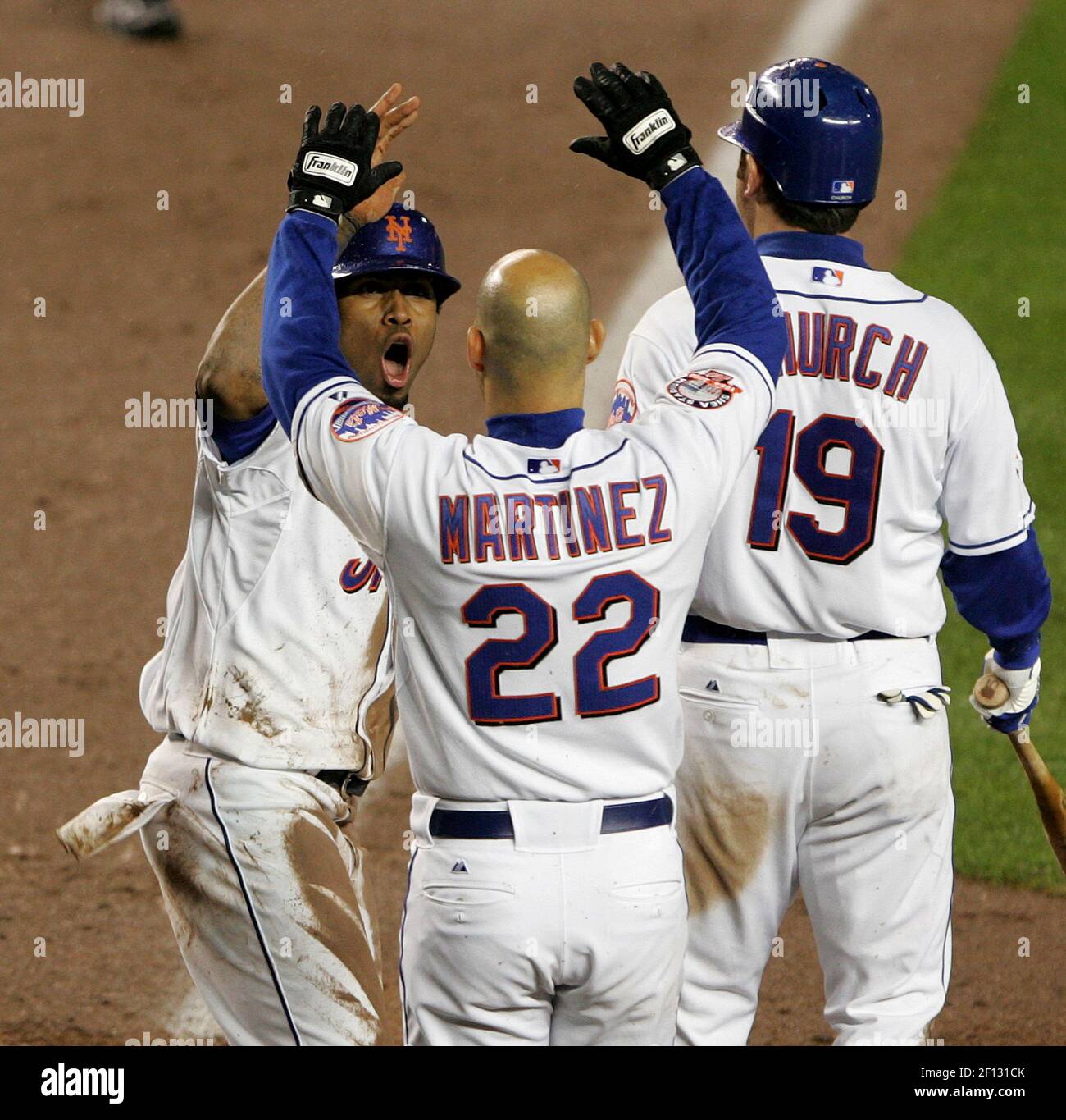 New York Mets Jose Reyes celebrates at home plate with Ramon Martinez ...